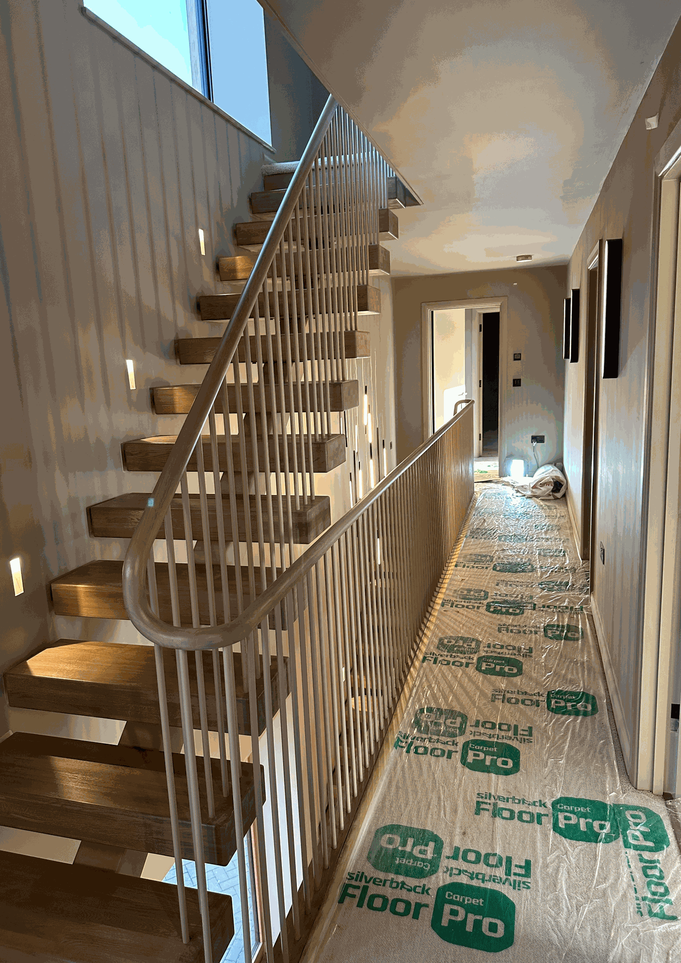 Central Spine Staircase Design with Continuous Handrail | OVOMS UK